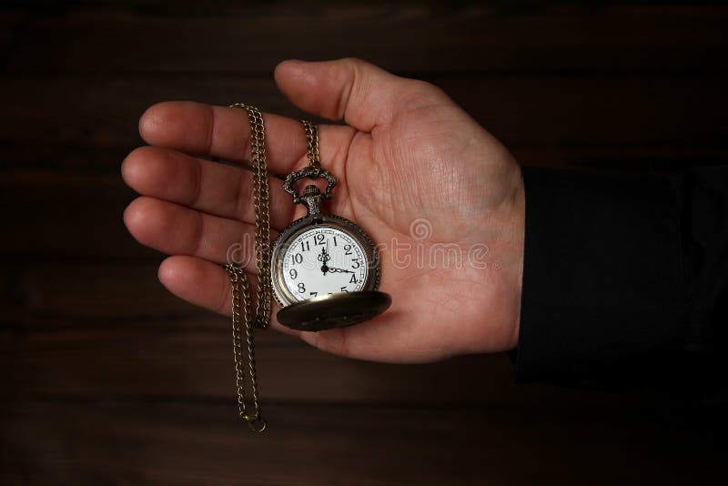 A Pocket Watch in the Hands of a Man Stock Photo - Image of hand ...