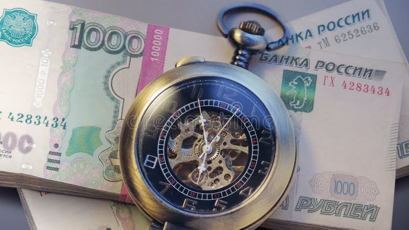 Pocket Watch with Pile of Money Stock Photo - Image of financial ...