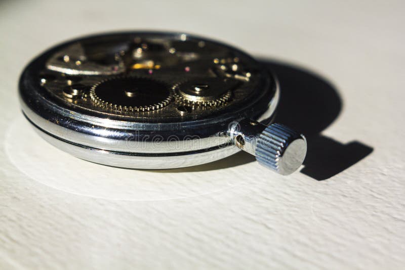 Pocket watch and shadow 3 stock image. Image of detail - 110873261
