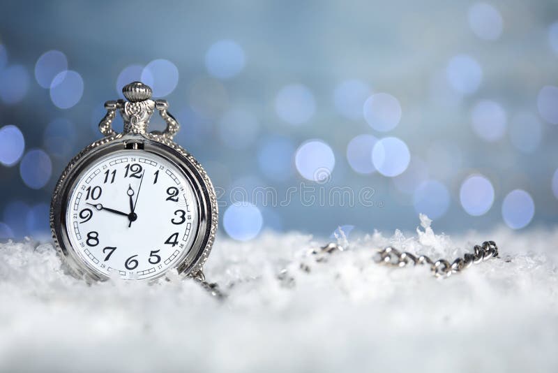 Pocket Watch on Table Against Blurred Lights. Christmas Countdown Stock ...