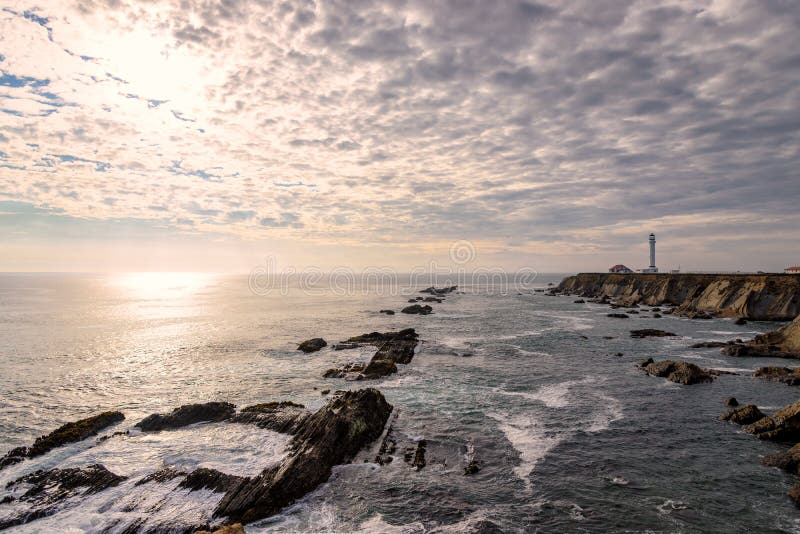 Point Arena Lighthouse with Splashing Surf at Sunset Stock Photo ...