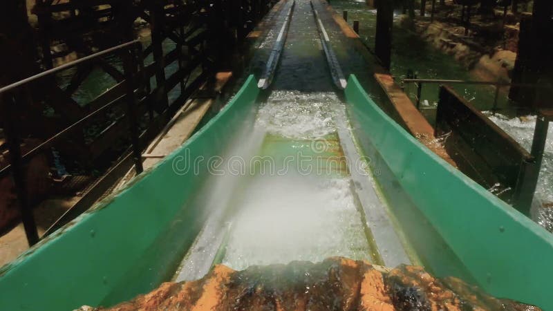 Point of View - Fun Wet Roller Coaster Boat Going Down the Hill into a ...