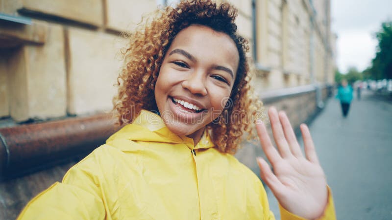 Point Of View Shot Of Cheerful Young Woman Blogger Looking At Camera