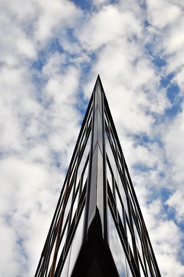 Pointed building in sky stock image. Image of cloud, shape - 74523727