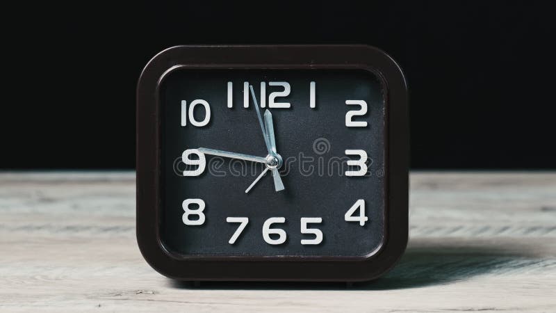 The Pointer Clock on Wooden Table and Black Background Show Time Stock ...
