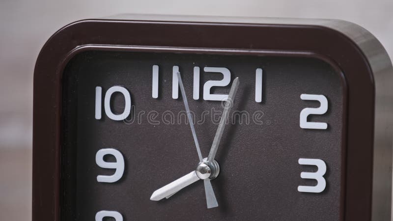 The Pointer Clock on a Wooden Table Shows the Time Stock Footage ...