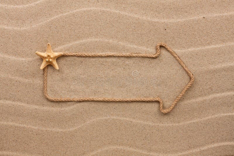 Pointer Made of Rope and Starfish on the Sand, with Place for Your Text ...