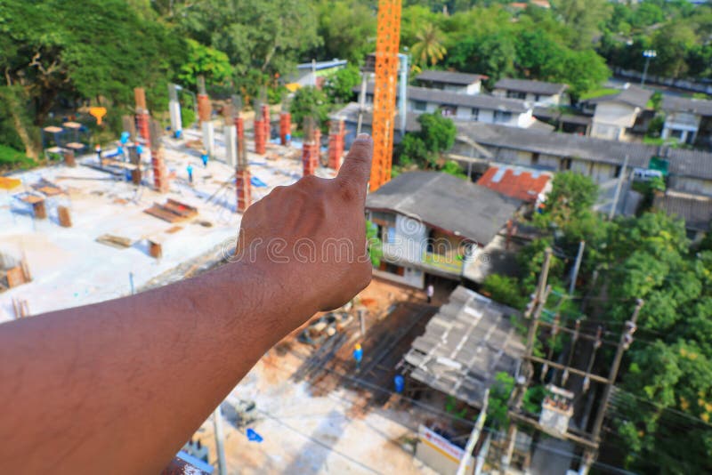Pointing at a Building Under Construction Stock Photo - Image of city ...