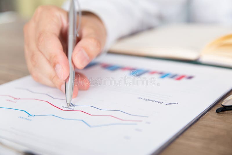 Pointing on Documents with Pen in Hand Stock Photo - Image of ...