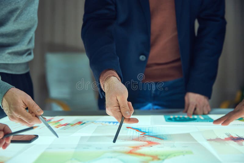 Pointing on Important Moments. Business People Working on Startup ...