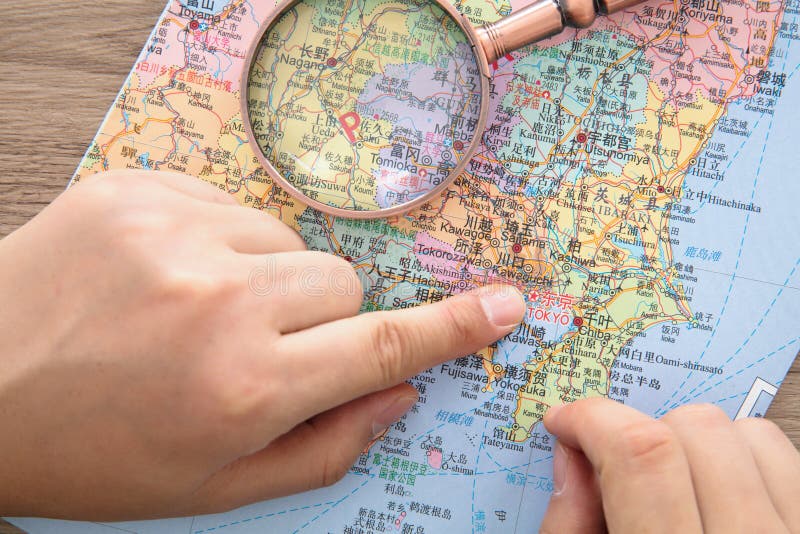 Pointing at the Location of Tokyo, the Capital of Japan, on the Map ...