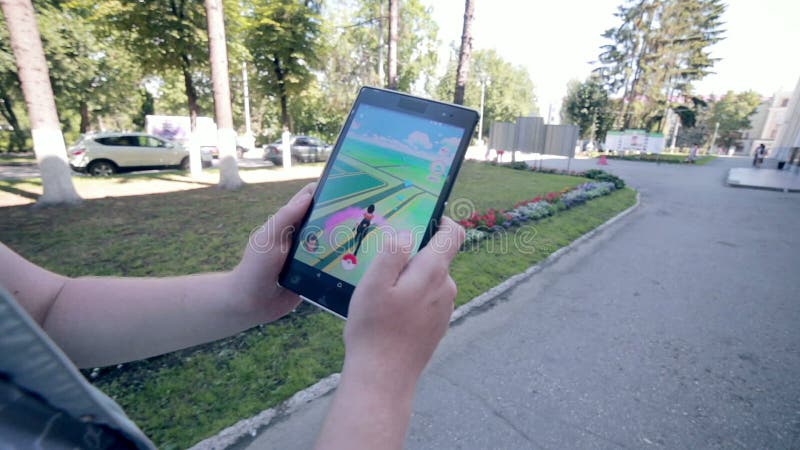Pokemon Go App Being Played by a Man on His Tablet. Stock Video - Video ...