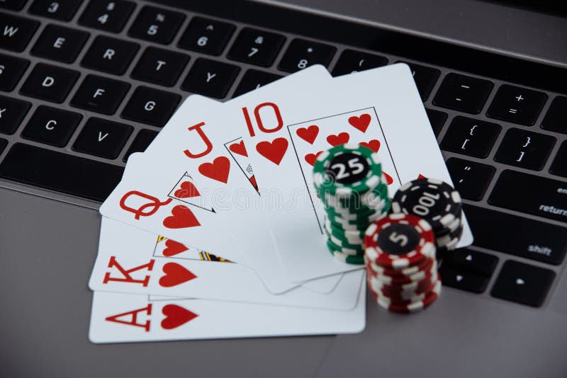 Poker Cards and Stacks of Poker Chips on a Laptop Computer. Poker ...