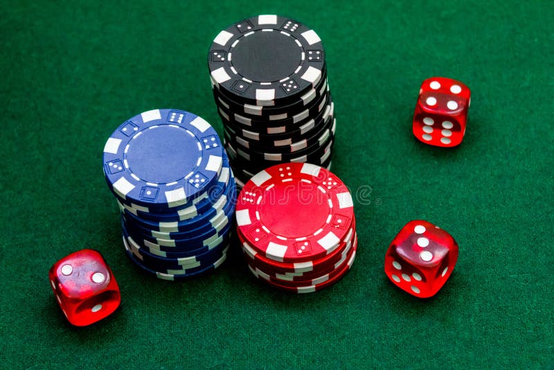Poker Chips and Dice on a Green Gaming Table Top View Close Up Stock ...