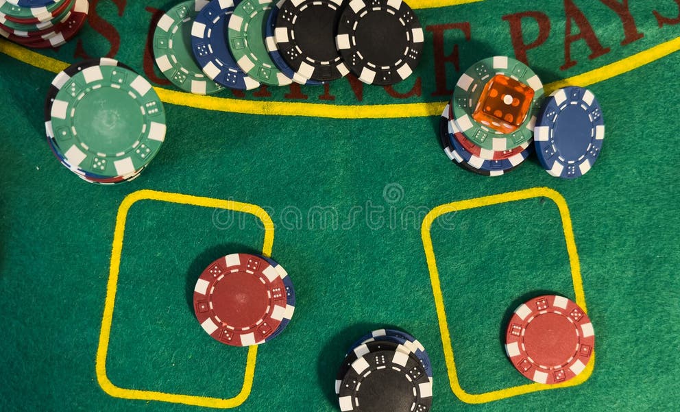 Poker Chips on a Gaming Table with Dramatic Lighting Stock Photo ...