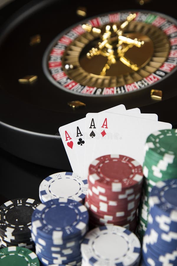 Poker Chips on Gaming Table, Roulette Wheel in Motion, Casino ...