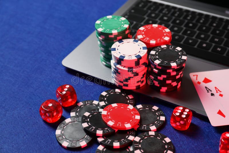 Poker Chips, Laptop, Playing Card and Dices on Blue Table. Online Game ...