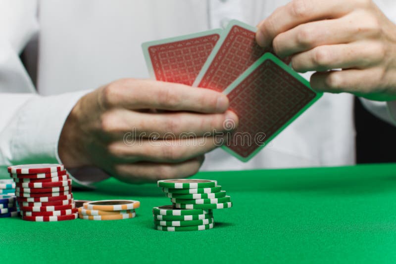 Poker Chips and the Player S Hand with the Cards Stock Image - Image of ...