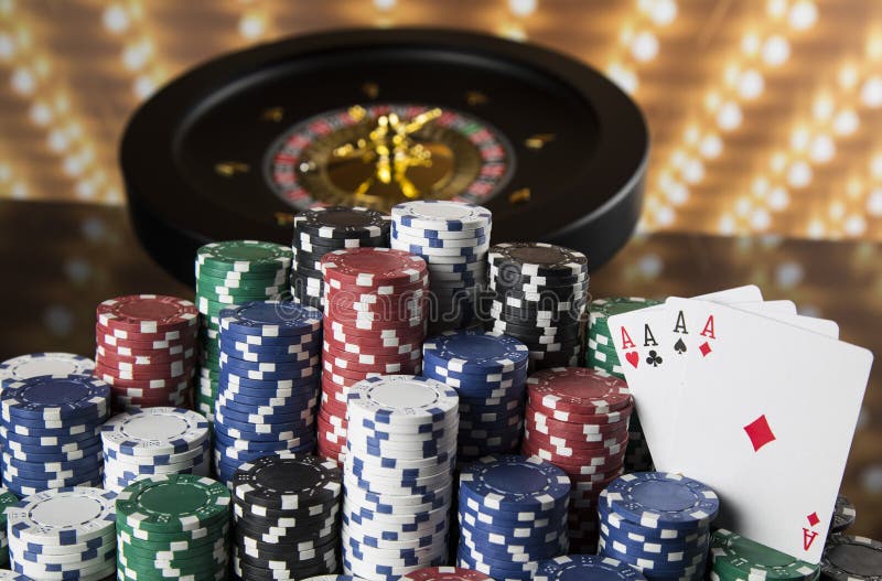 Poker Chips, Roulette Wheel in Motion, Casino Background Stock Photo ...