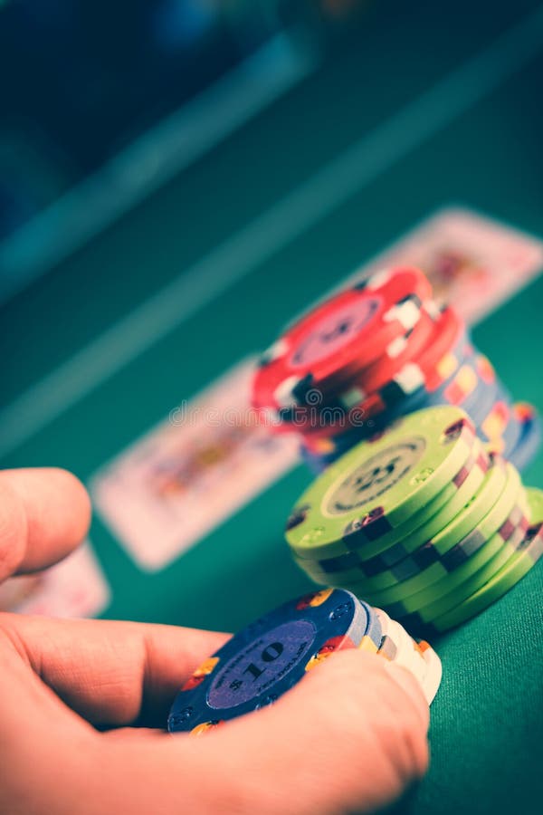 Poker hand at the casino stock photo. Image of hand - 186496420