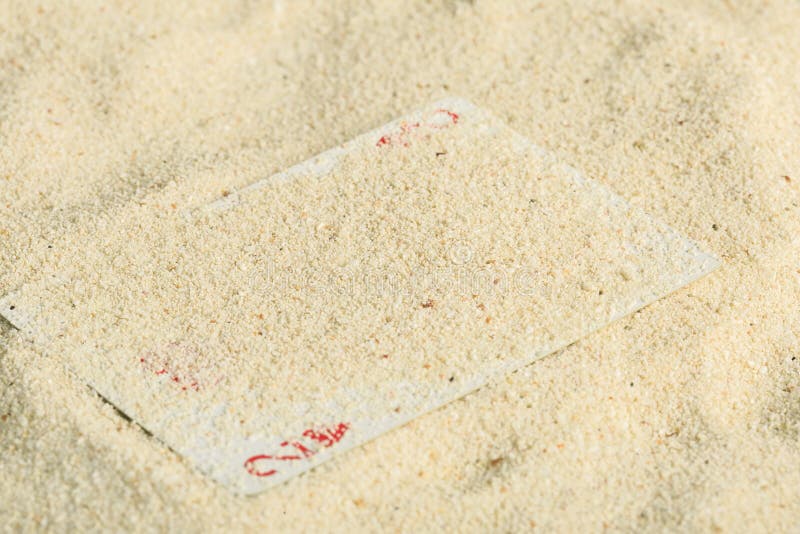 Poker Playing Cards Buried in a Sand Dune Stock Photo - Image of aces ...