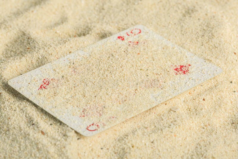 Poker Playing Cards Buried in a Sand Dune Stock Image - Image of coins ...