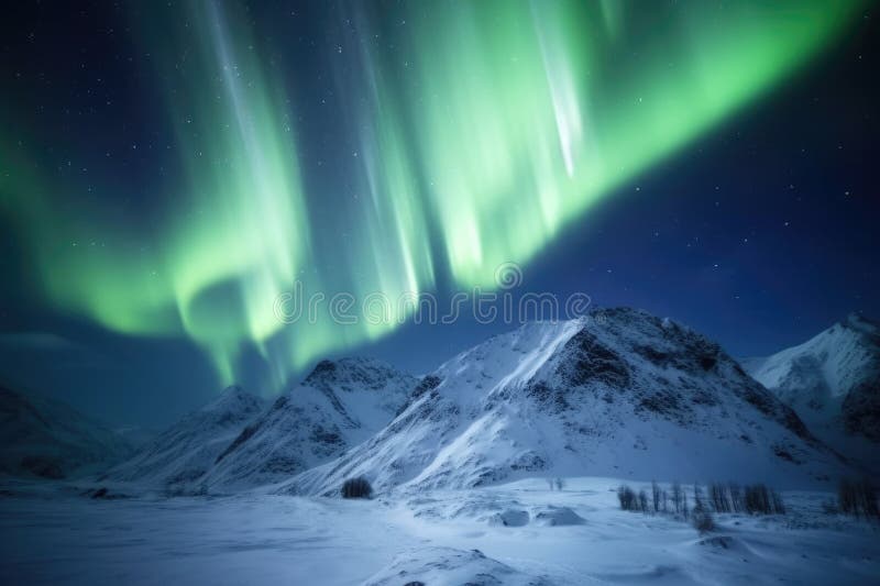 Polar Light Phenomena Over Rugged Mountain Peaks in Snow Stock Photo ...