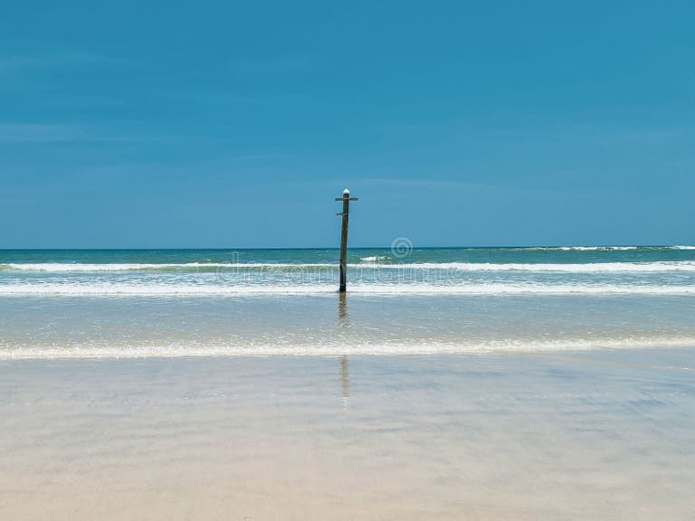 Pole on the Beach Splitting the Waves Stock Photo - Image of travel ...