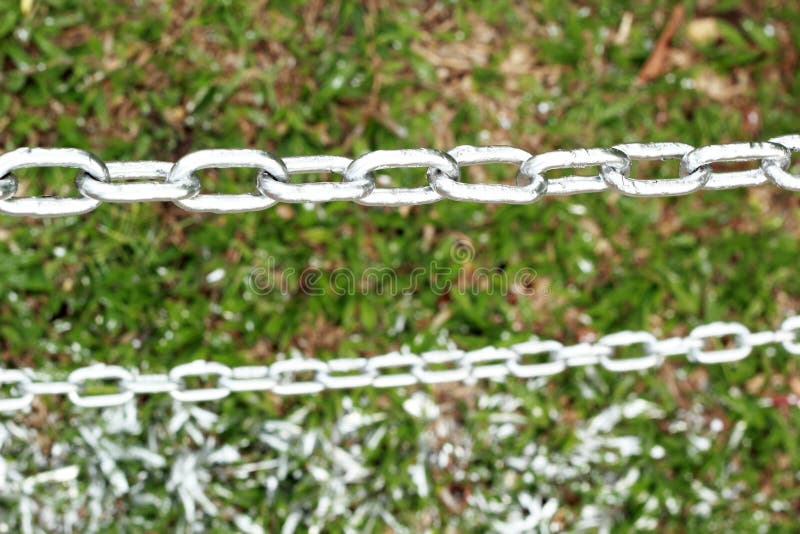 Pole chain on the grass. stock photo. Image of space - 39361086