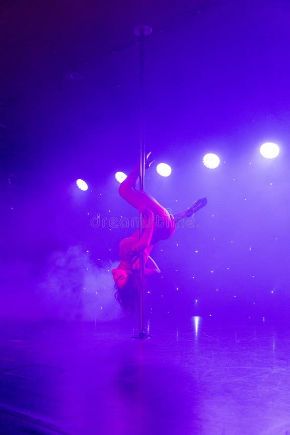 Pole Dancer Performance Under Violet Light Stock Photo - Image of ...