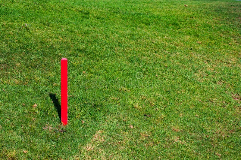 Red pole on the lawn stock photo. Image of sport, field - 147392688
