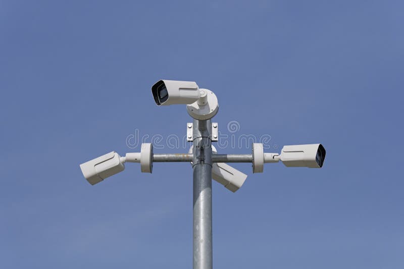 Pole Mounted Security Cameras Against Blue Sky Stock Image - Image of ...