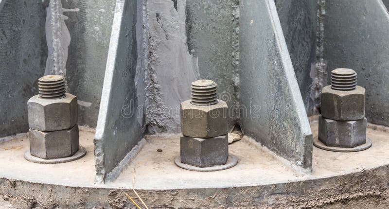 Pole Flange with Heavy Threaded Galvanized Studs and Nuts on a Concrete ...