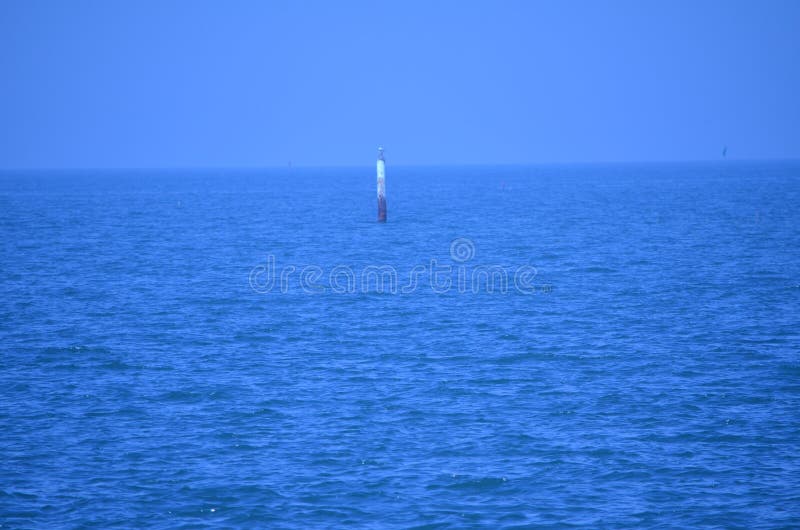 Pole in the sea. stock image. Image of pillar, blue - 106234939
