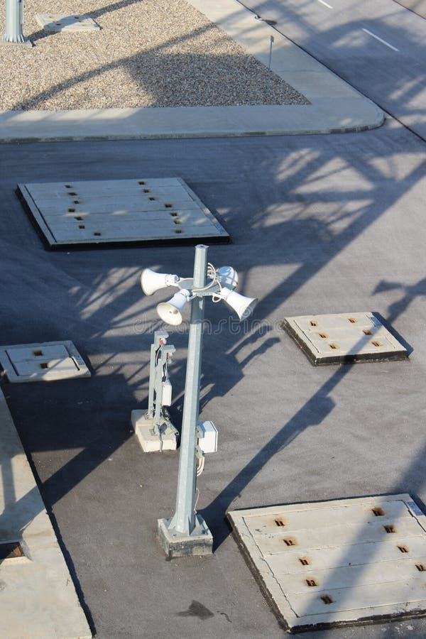 A Pole with Several Loudspeakers and Electrical Components in an ...