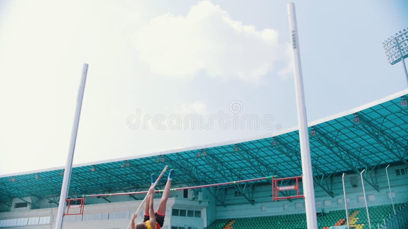 Pole Vault Training - a Woman Successfully Jumping Over the Bar and ...