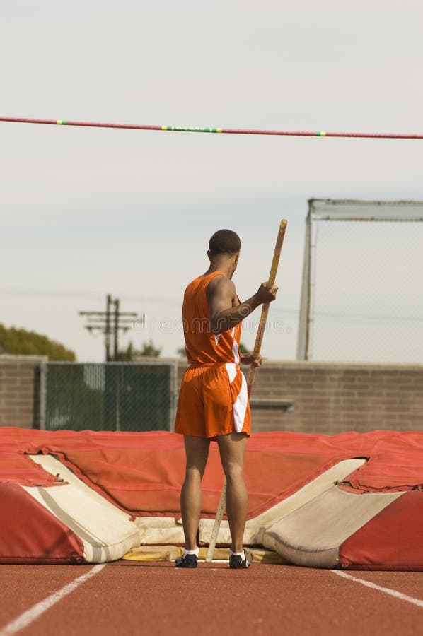 Pole Vaulter Standing with Pole Stock Image - Image of adult, ethnicity ...