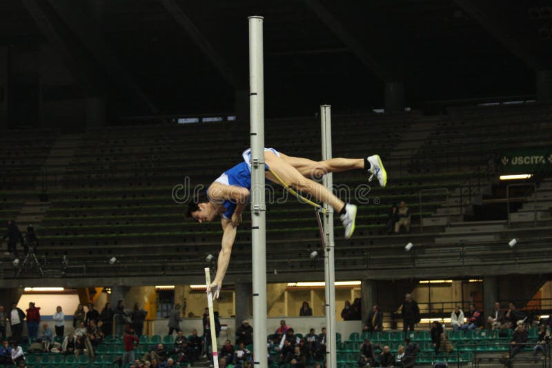 Male Athlete Performing A Pole Vault Stock Image - Image of person ...