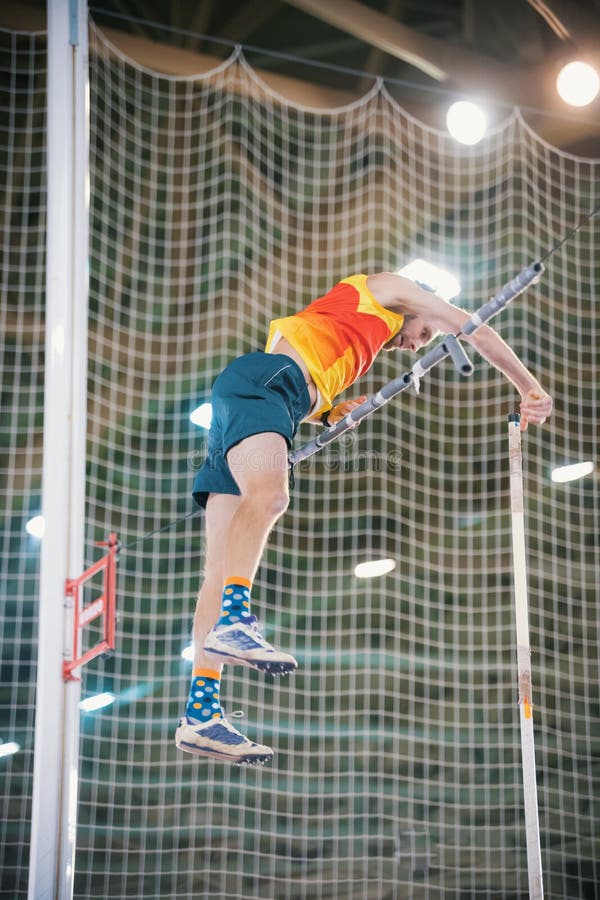 Pole Vaulting - Man is Falling after Jump with Pole Stock Photo - Image ...