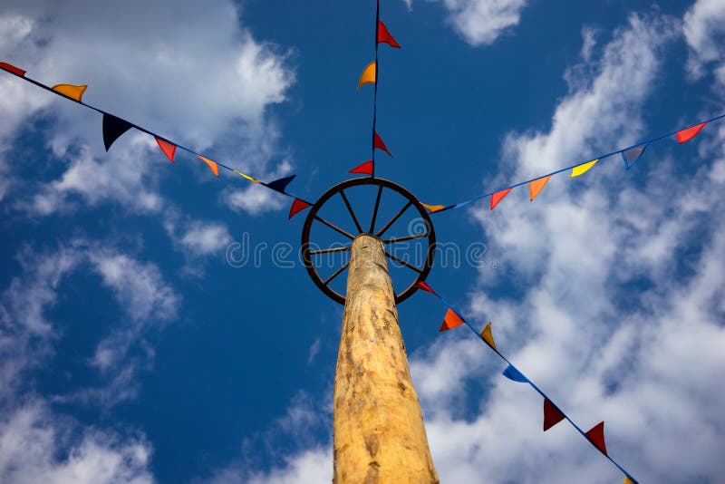 Pole Wheel and Colored Flags on Sky Background Stock Photo - Image of ...