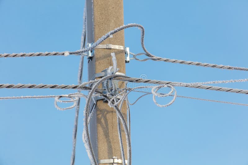 A Pole with Wires on it is Covered in Ice Stock Image - Image of frozen ...