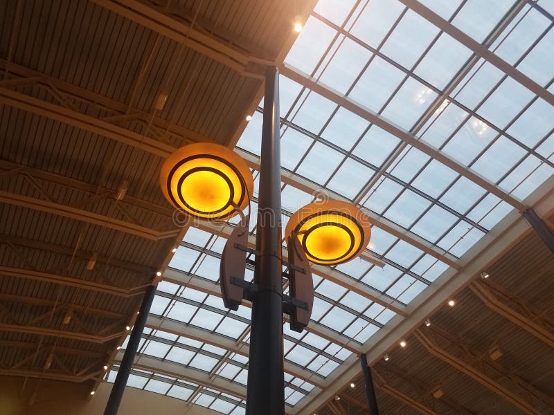 Pole and Yellow Light in Building with Glass Ceiling Stock Photo ...