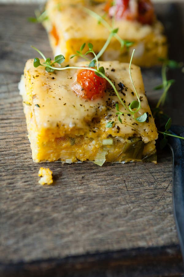 Polenta with a Tomato on the Board Stock Image - Image of cornmeal ...