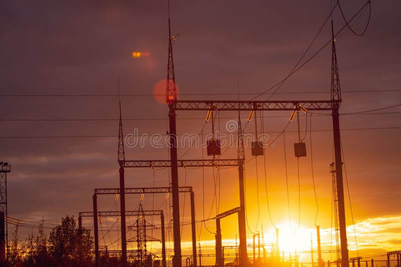 Poles at a Power Plant at Sunset As a Background Stock Photo - Image of ...