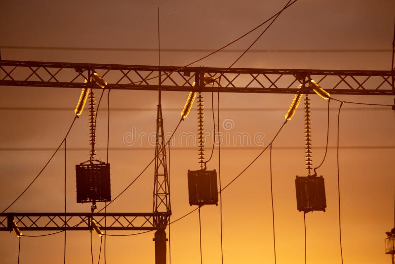 Poles at a Power Plant at Sunset As a Background Stock Image - Image of ...