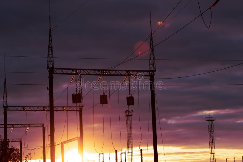 Poles at a Power Plant at Sunset As a Background Stock Image - Image of ...