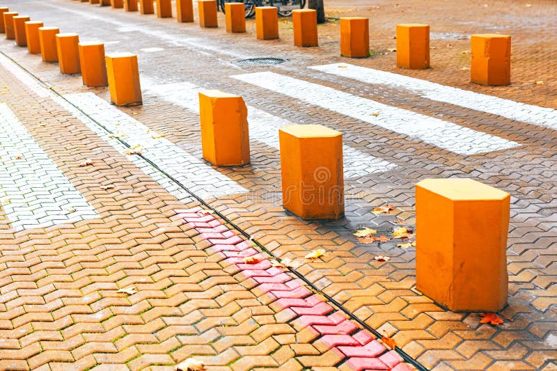 Poles Standing at Crosswalk with a Red Line Stock Photo - Image of walk ...