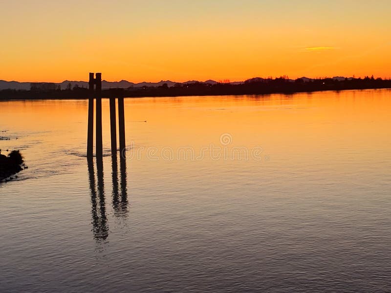 4 poles sunset stock photo. Image of ocean, wave, poles - 265398982