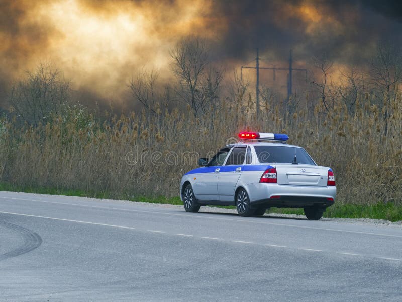 Police Car by the Roadside. the Sky is in Smoke. Stock Image - Image of ...