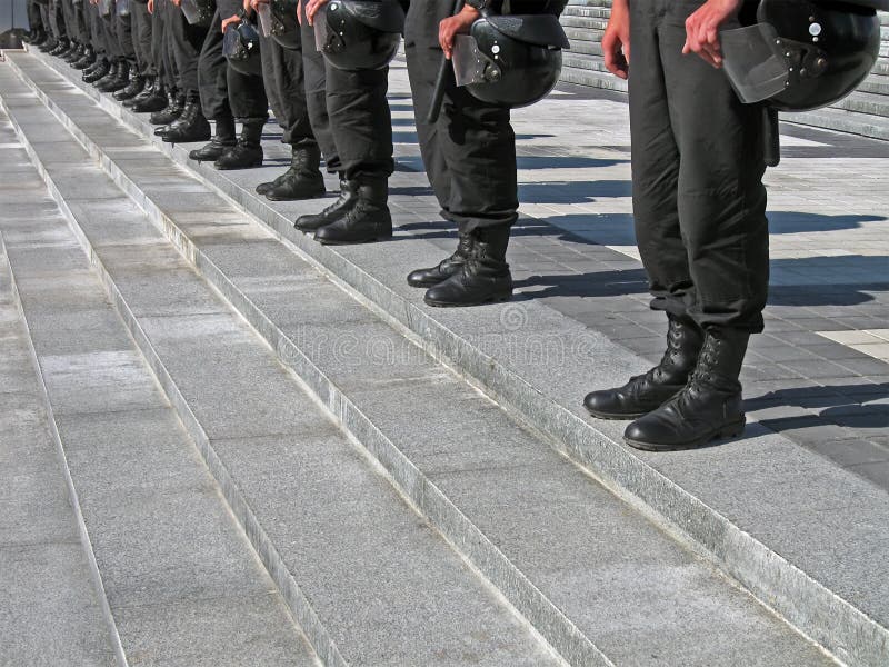 Police Cordon in Black Uniform, Hard Hat (helmet), Stock Photo - Image ...